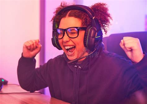 Winner Streamer Or Woman Gamer Success On Computer With Microphone Celebrating Game Win Or Fist