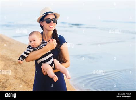 Mother Walking With Baby Boy Stock Photo Alamy