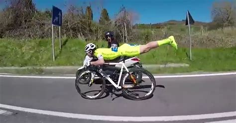 Cyclist Does Best Superman Impression To Race Past Rivals With