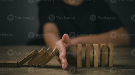 Hand Stopping Domino Effect Concept Of Risk Protection Business