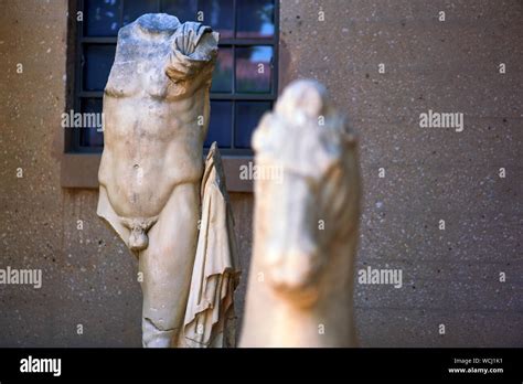 Ancient Greek And Roman Statues On Display In The Museum In Corinth