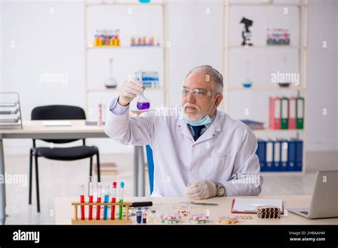 Old Chemist In Drug Synthesis Concept Stock Photo Alamy