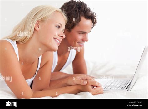 Lovely Couple Using A Laptop Stock Photo Alamy