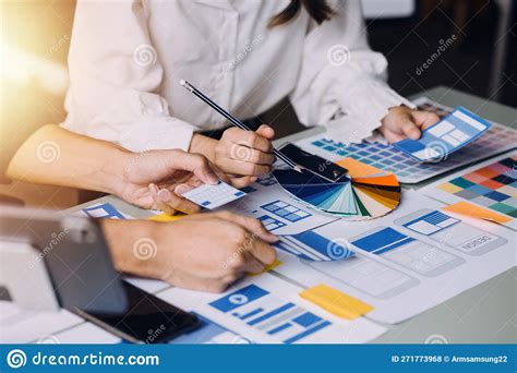 close up ux developer and ui designer brainstorming about mobile app