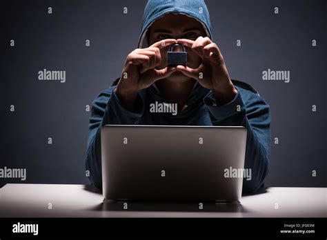 Computer Hacker Working In Dark Room Stock Photo Alamy