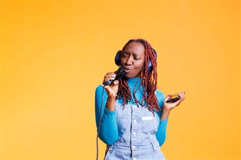 Premium Photo Confident Girl Having Fun With Karaoke Vocalist