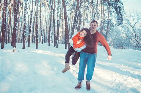 Man Carries Woman For Fun Happy Couple Laughing And Having Good Time