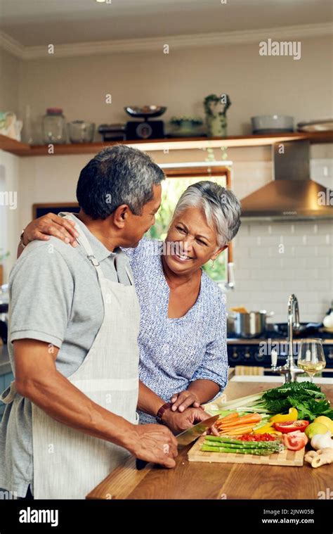 Making Cooking Time Bonding Time A Happy Mature Couple Cooking A Meal