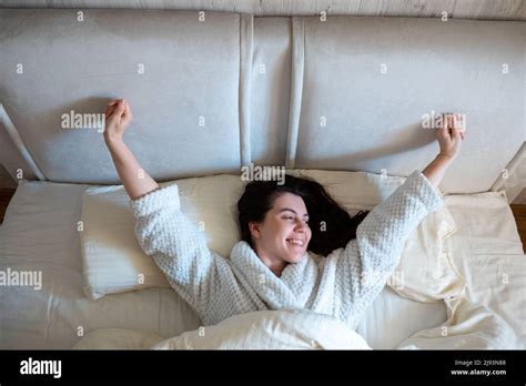 Morning In Bed Woman Awaking Laying Down In Bed With White Sheets Bright Room Stock Photo Alamy
