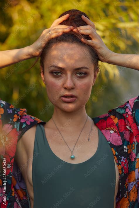A Beautiful Face Model Stands On The Reeds Beach In A Sexy Swimsuit