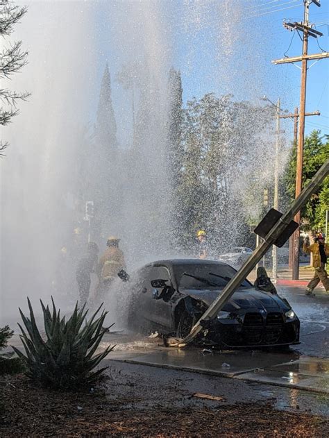 Double Bmw Crash Shears Fire Hydrant Topples Light Pole At La Valley