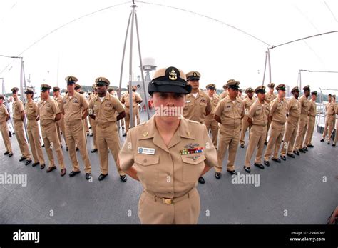 Us Navy Chief Cryptologic Technician Stands At The Head Of The