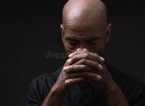 Black Man Praying To God Caribbean Man Praying With Bible Background