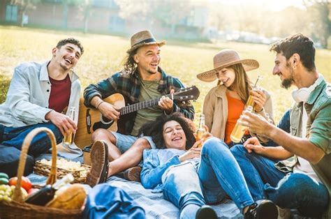 Premium Photo Happy Friends Having Picnic In The Park Group Of Young