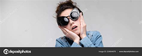 Young Brunette Girl In Black Glasses Cat Glasses The Hair Is Gathered