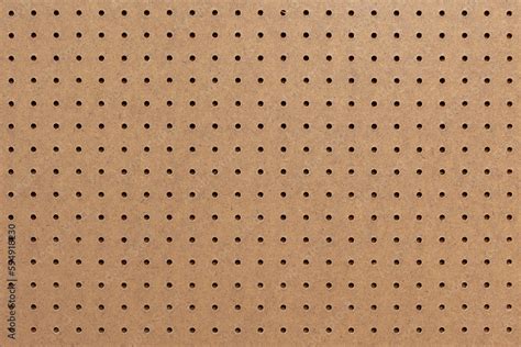 Abstract Background Of Brown Perforated Hardboard Sheet Plywood With