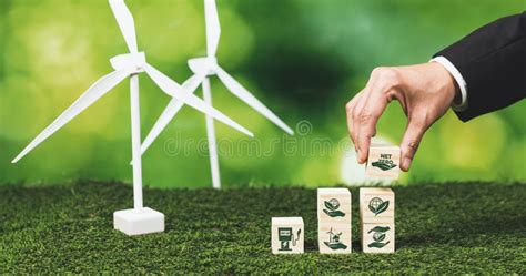 Businessman Putting Net Zero Symbol Cube On Stack Top For Green Corporate Alter Stock Image