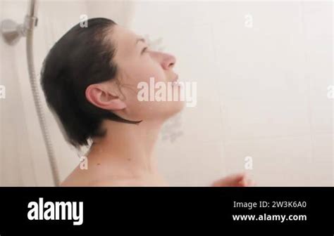 Naked Woman Takes A Shower Woman Washes Her Short Hair With Water