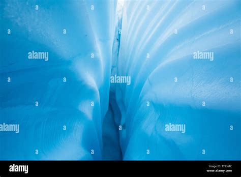 Textured Lines Leading Down Into A Crevasse Ice Structure And Line