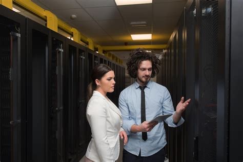 Premium Photo Young It Engineer Showing Working Data Center Server
