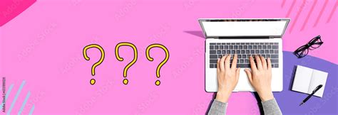 Question Marks With Person Using A Laptop Computer Stock Photo Adobe Stock