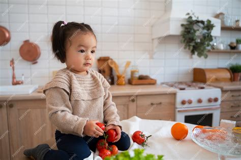 Free Photo Young Asian Girl In The Kitchen At Home