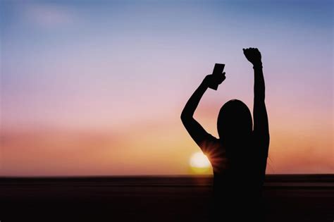 Premium Photo Silhouette Of Young Woman With Abstract Blur Sunset On