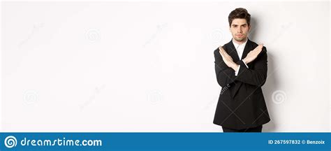 Portrait Of Serious And Concerned Man In Black Suit Showing Stop