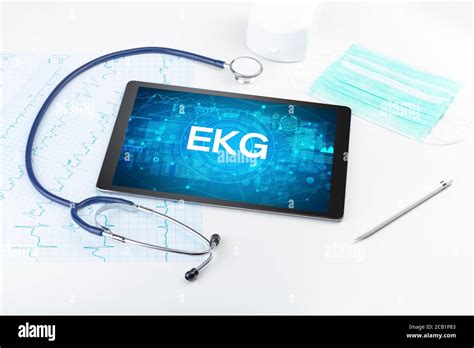 Close Up View Of A Tablet Pc With Ekg Abbreviation Medical Concept