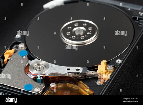 Disassembled Laptop Hard Disk Drive Hdd Close Up Opened Hard Drive Magnetic Heads And Disk