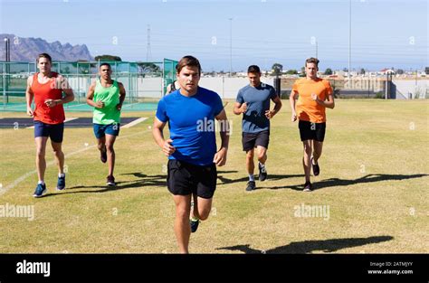 Men Running To Train Stock Photo Alamy