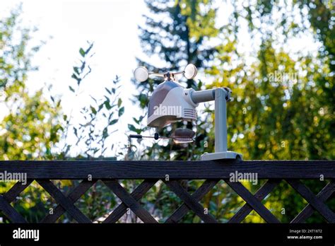 Wireless Weather Station Is Mounted On A Wooden Fence Personal Weather Forecasting Device Stock