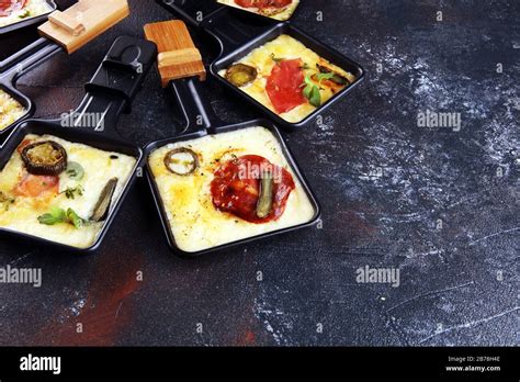 Delicious Traditional Swiss Melted Raclette Cheese On Diced Boiled Or