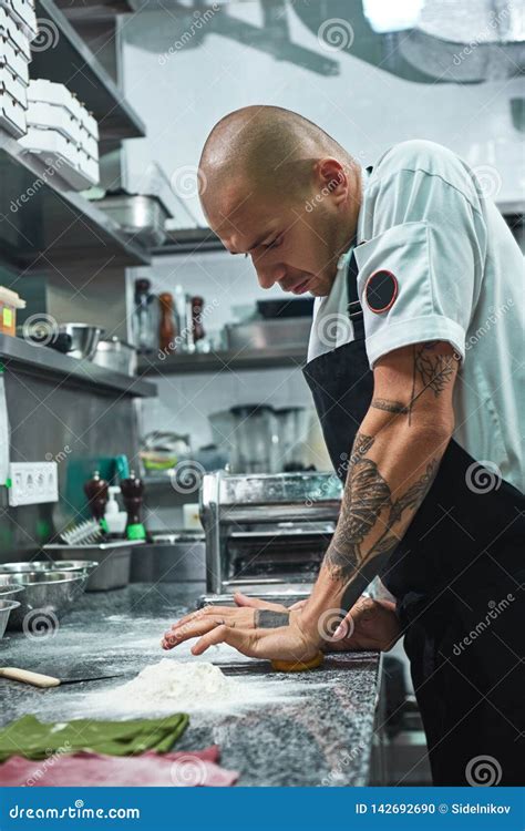 Working Process Vertical Photo Of Handsome Professional Chef With