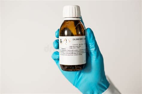 Glass Bottle Of Chloroform Solvent With A Label Warning About Toxicity