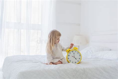 Analog Alarm Clock Showing Nine O`clock 9pm Or 9 Am Isolated On White