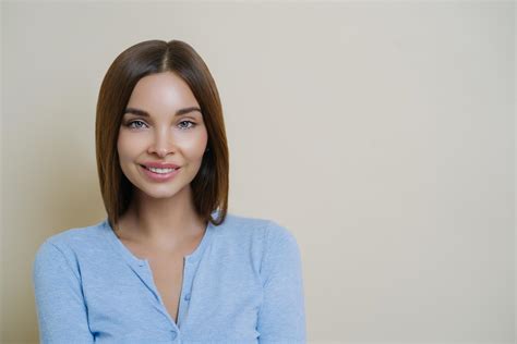 Photo Of Adorable Brunette Woman Has Natural Makeup And Healthy Perfect Skin Smiles Tenderly