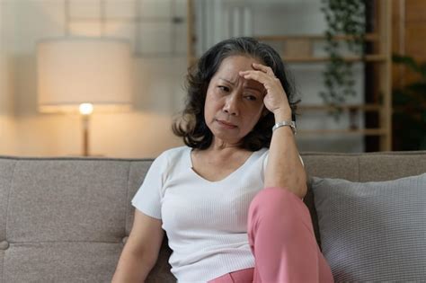 Premium Photo Depressed Elderly Asian Woman Sitting Alone At Home