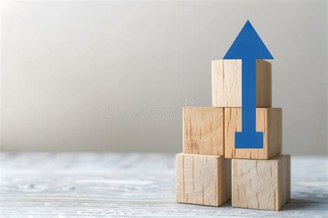 Wooden Blocks With Blue Arrow And Growing Graph Chart Ai Generated