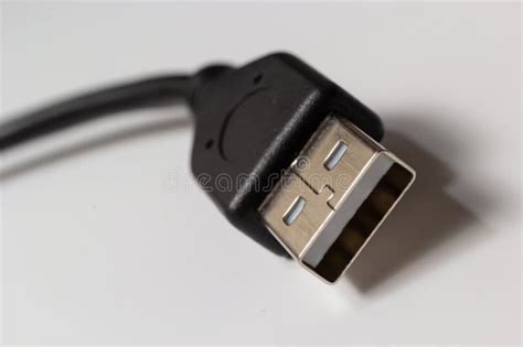 Close Up Of USB Cable On White Background Data Transfer Technologies Between Devices Via Cable