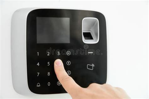 Young Woman Entering Code On Alarm System Keypad Stock Image Image Of