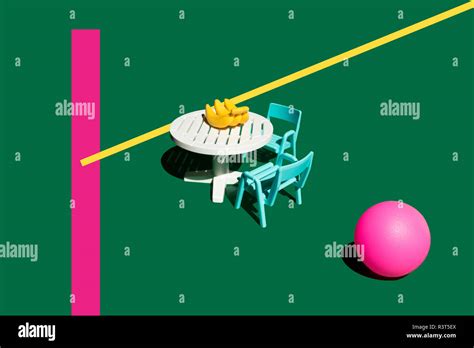 3D Rendering Table Chairs Bananas Pink Ball Miniature Stock Photo
