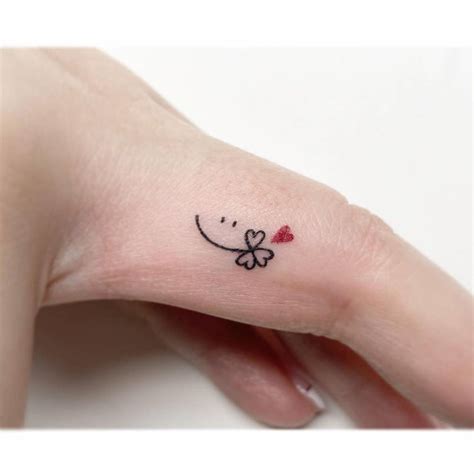 Minimalist Smiley Tattoo On The Finger