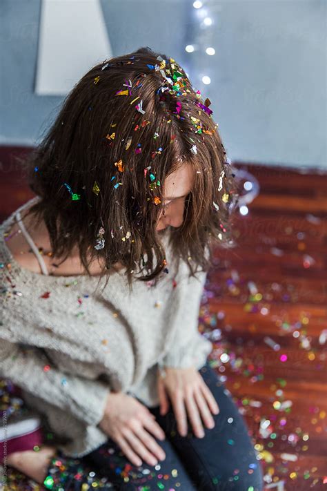 Portrait Of A Beautiful Girl With Confetti All Over Her Head By