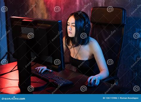 Beautiful Professional Gamer Girl Playing In First Person Shooter