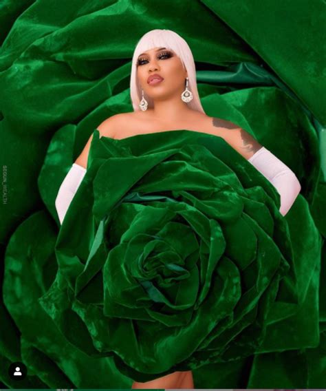 Toyin Lawani Barely Covers Her Naked Body With A Giant Green Flower To