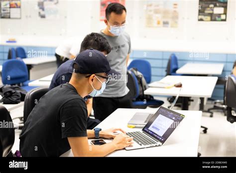17112020 Teacher Or Professor And College Or University Students With Computer Have Small Group