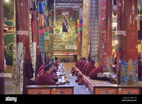 Tibetan Monks Inside The Gonchen Monastery In Dege Sichuan China