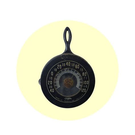An Old Fashioned Kitchen Scale On A White Background