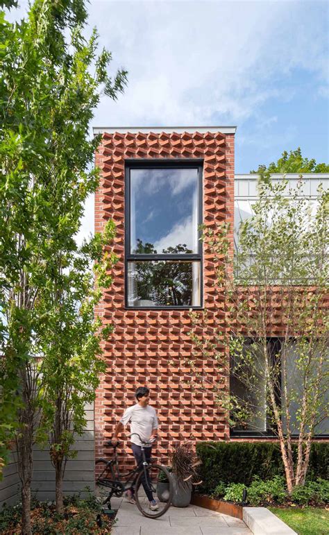 A Laneway House With A Rotated Brick Facade